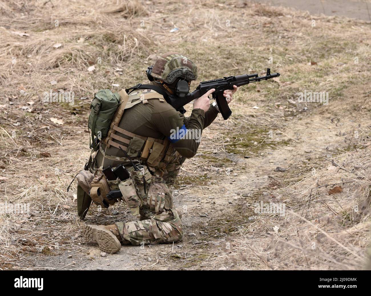 Soldiers during combat. Ukrainian soldiers with assault rifle take part ...