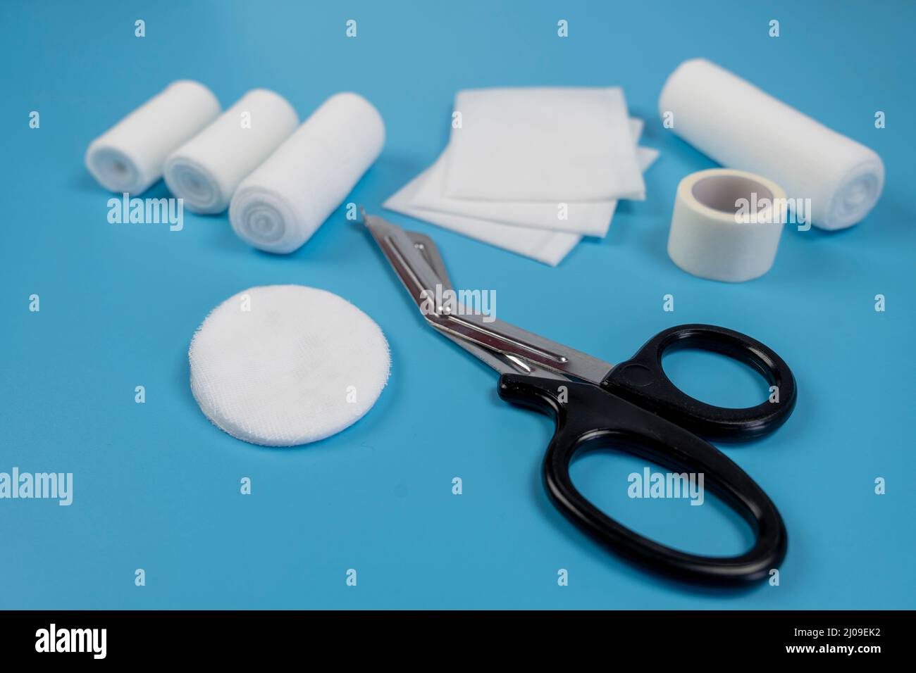 First aid kit against blue colored surface Stock Photo - Alamy