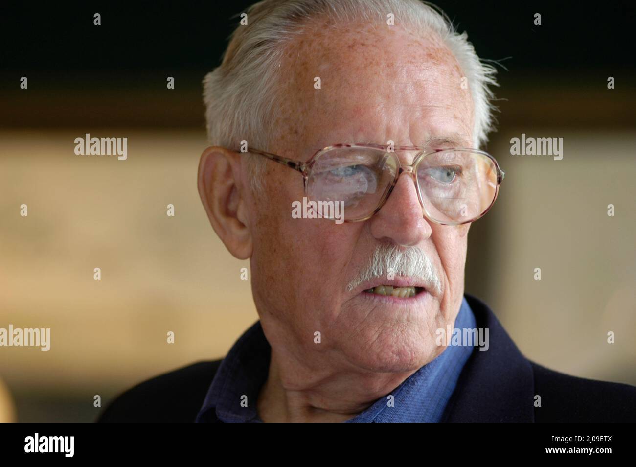 Senior white haired grandfather who has glasses Man at a family ...