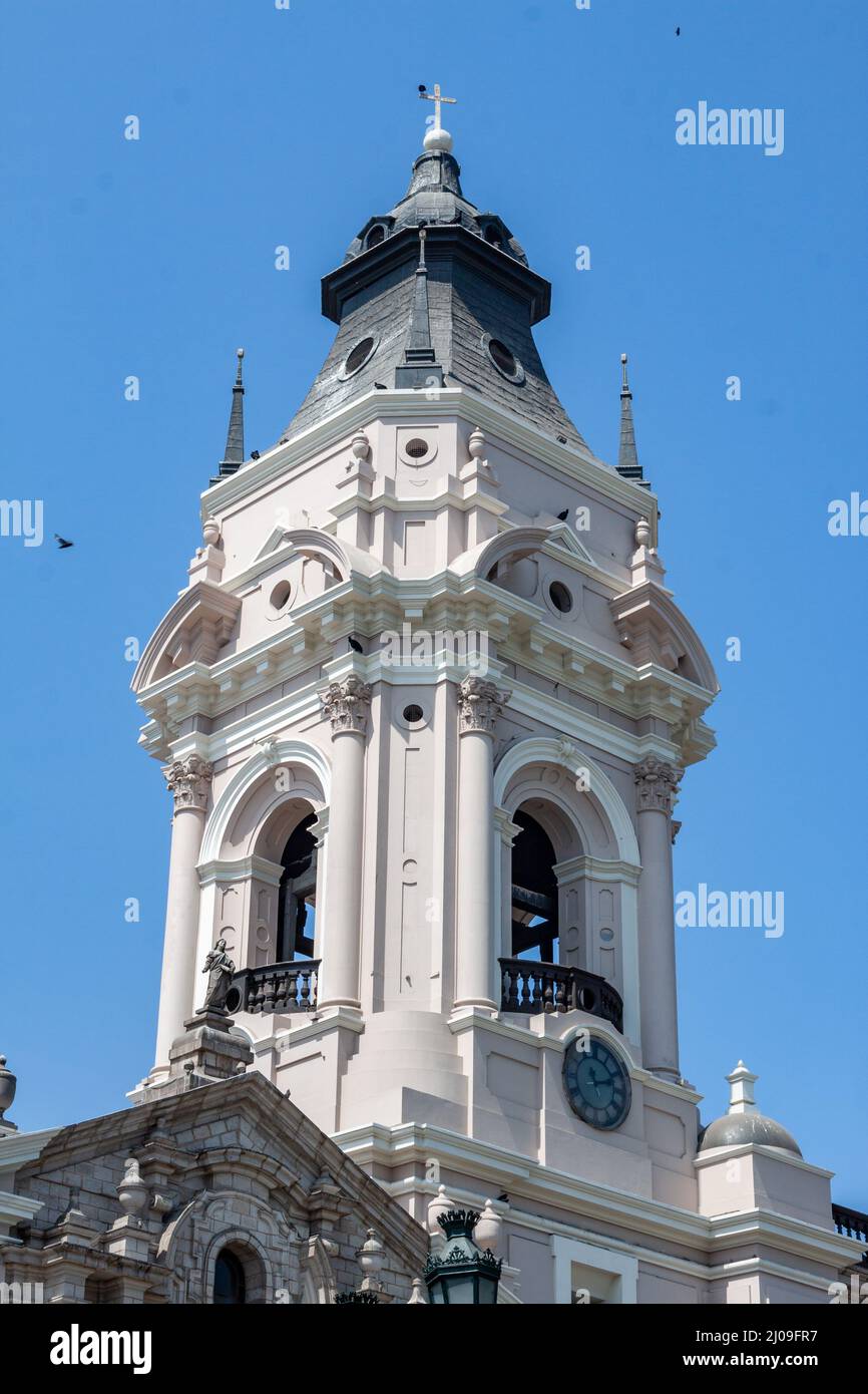Vertical shot of the tower of the cathedral of Lima with sculptures in ...