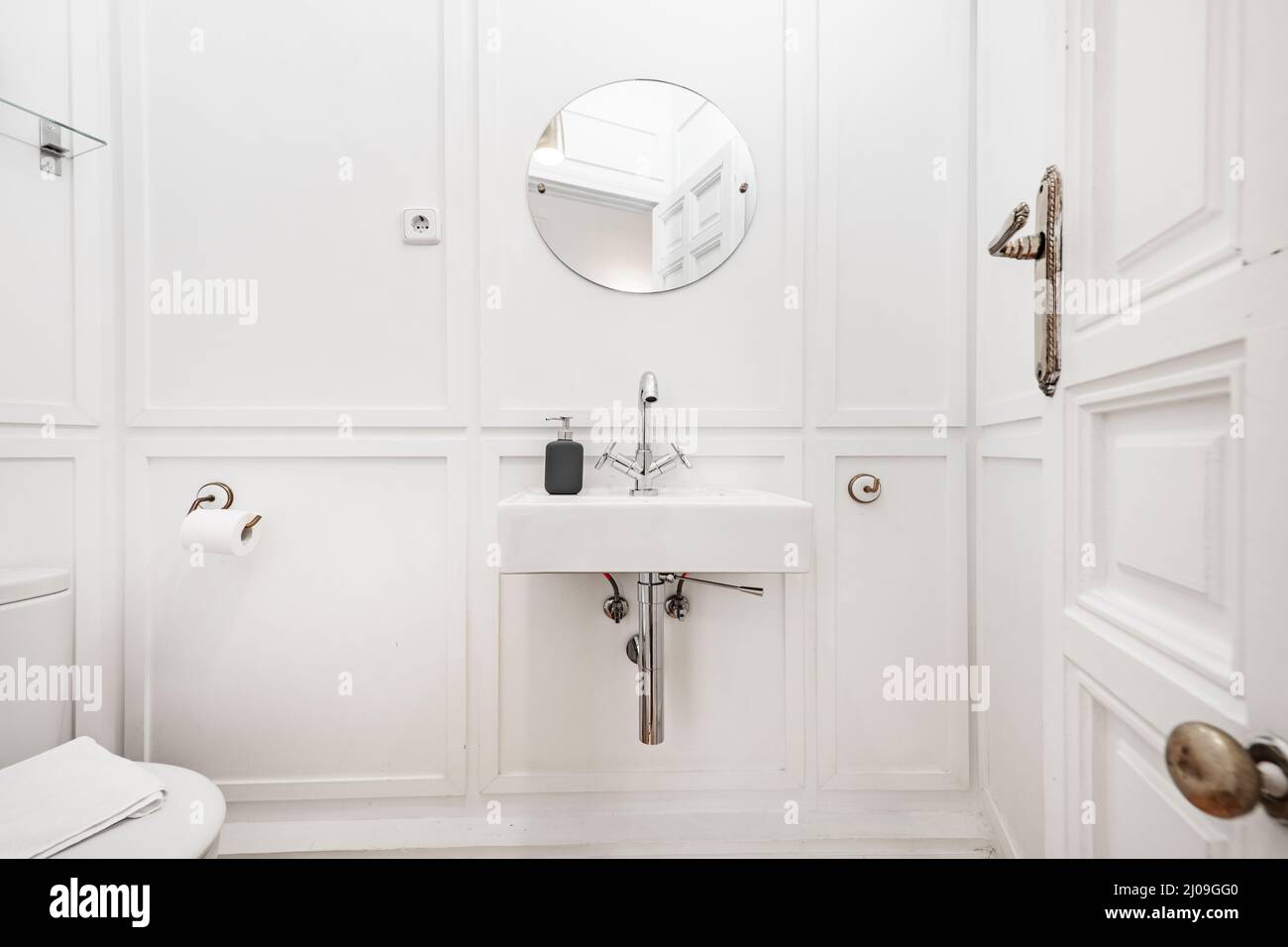 Hanging white porcelain sink on a white wooden wall with vintage faucet ...
