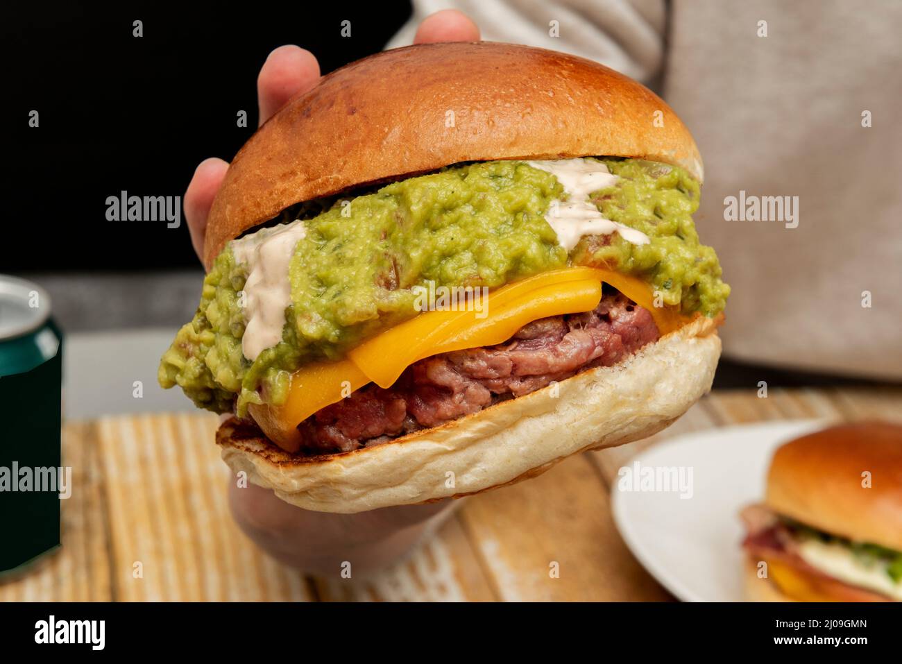 A delicious double cheddar beef patty with lots of guacamole and ...