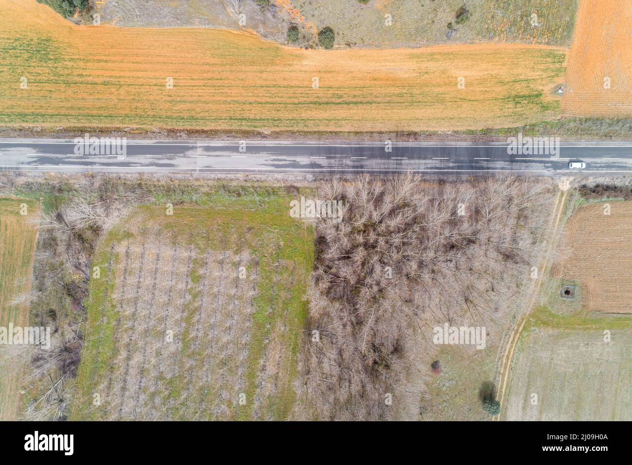 Aerial view of a straight stretch of road in wintertime Stock Photo - Alamy