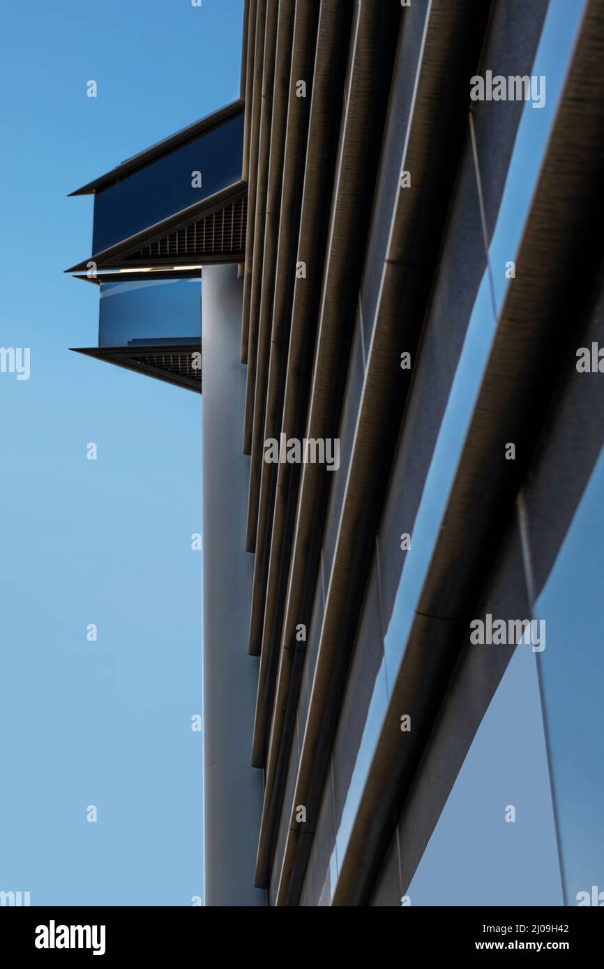 Steel and glass office building facade on a cloudless sunny winter day ...