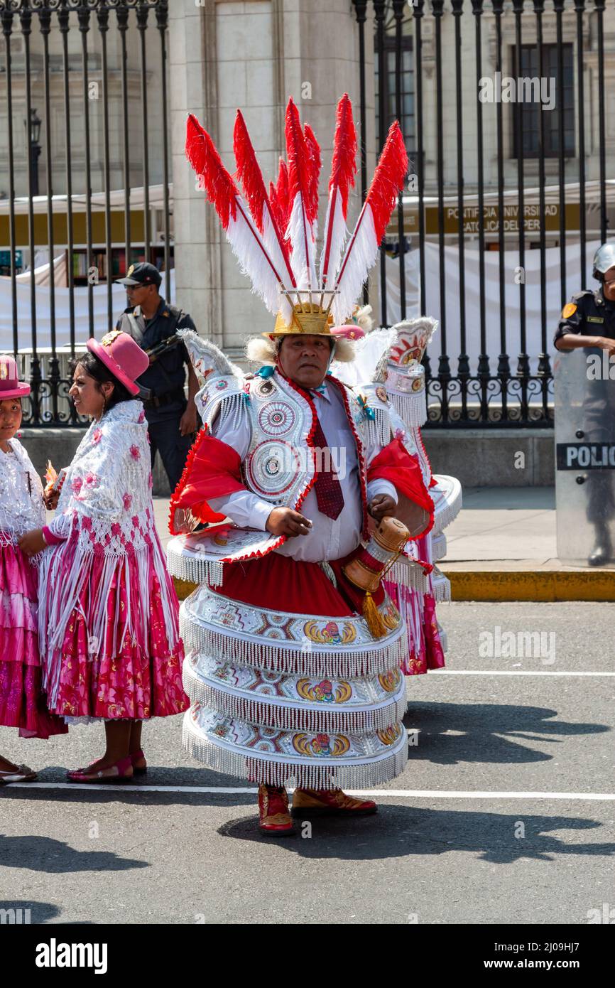 Vertical shot of people in typical folkloric Indian costumes in Plaza ...