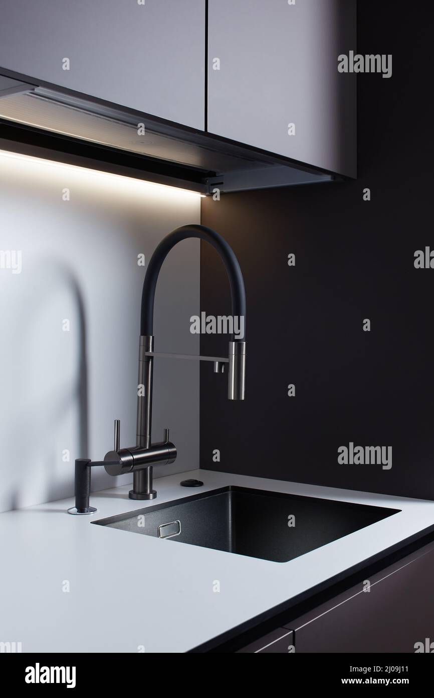 Black Kitchen water mixer. Water tap made of chrome material. Dark ...