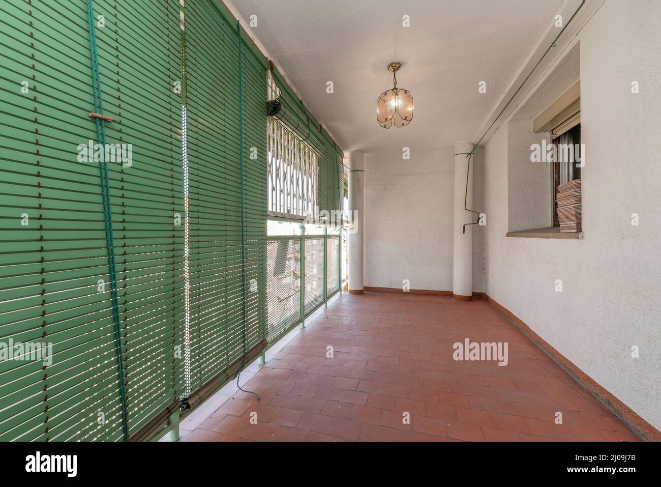 closed terrace with aluminum and glass with green shutters Stock Photo ...
