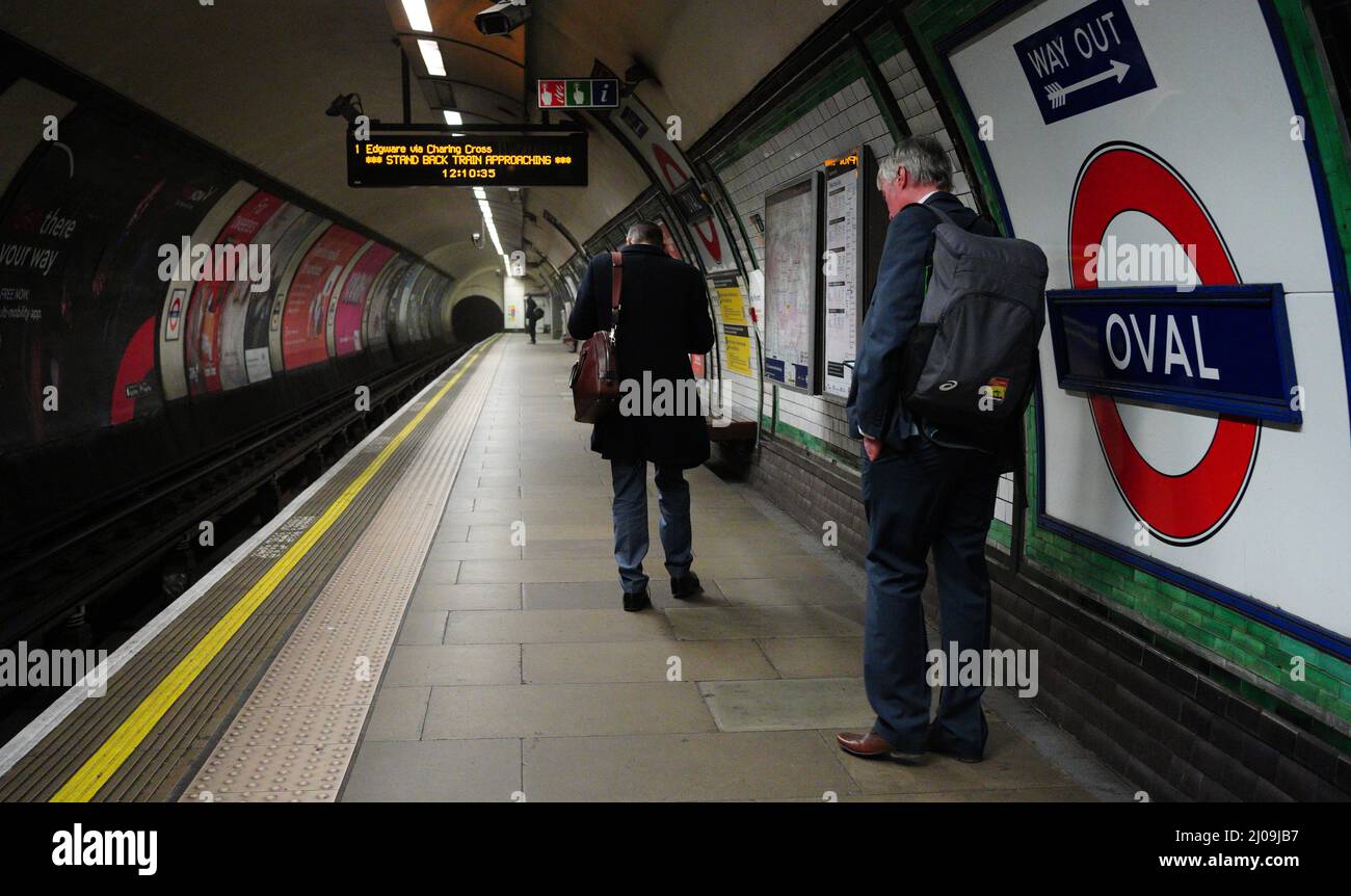 Generic stock of commuters waiting to board a train at Oval station ...