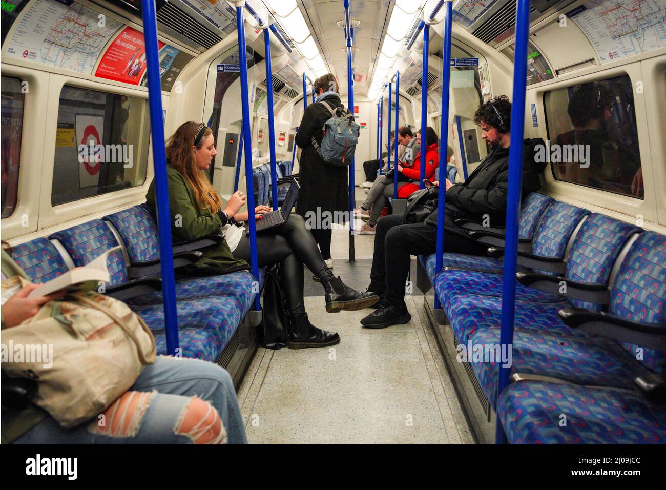 Generic stock of commuters on a Victoria line train at Stockwell ...