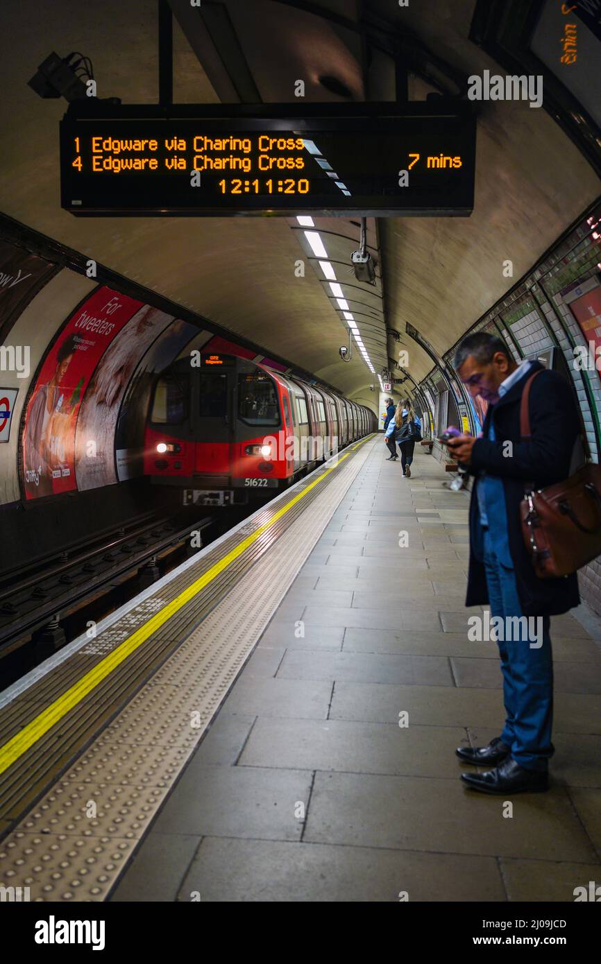 Generic stock of commuters waiting to board a train at Oval station ...