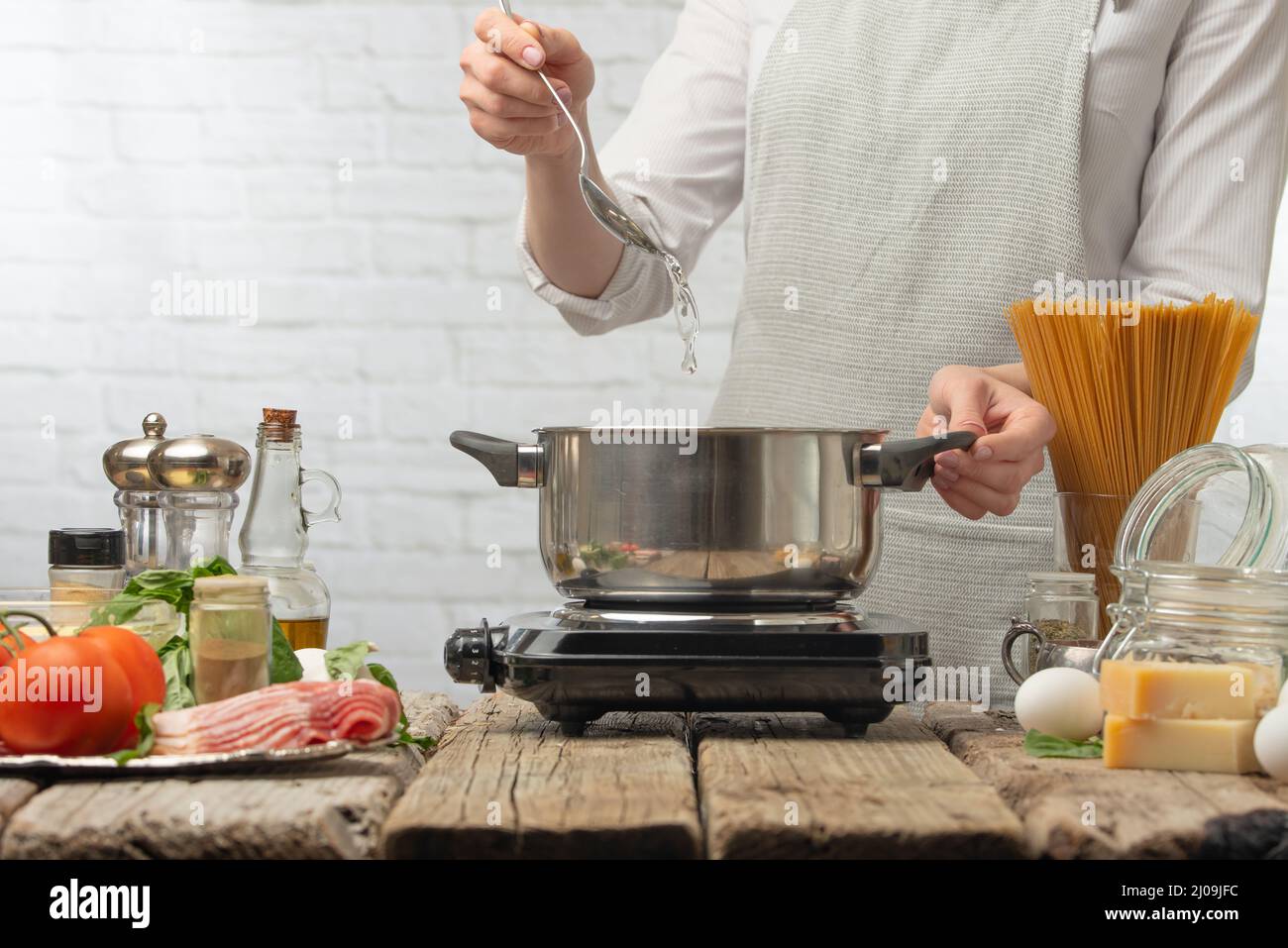 Professional chef preparing boiling water for cooking pasta alla ...