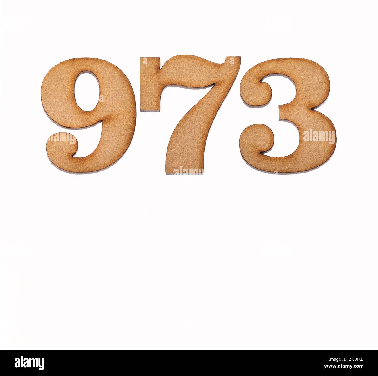 Number 973 in wood, isolated on white background Stock Photo - Alamy