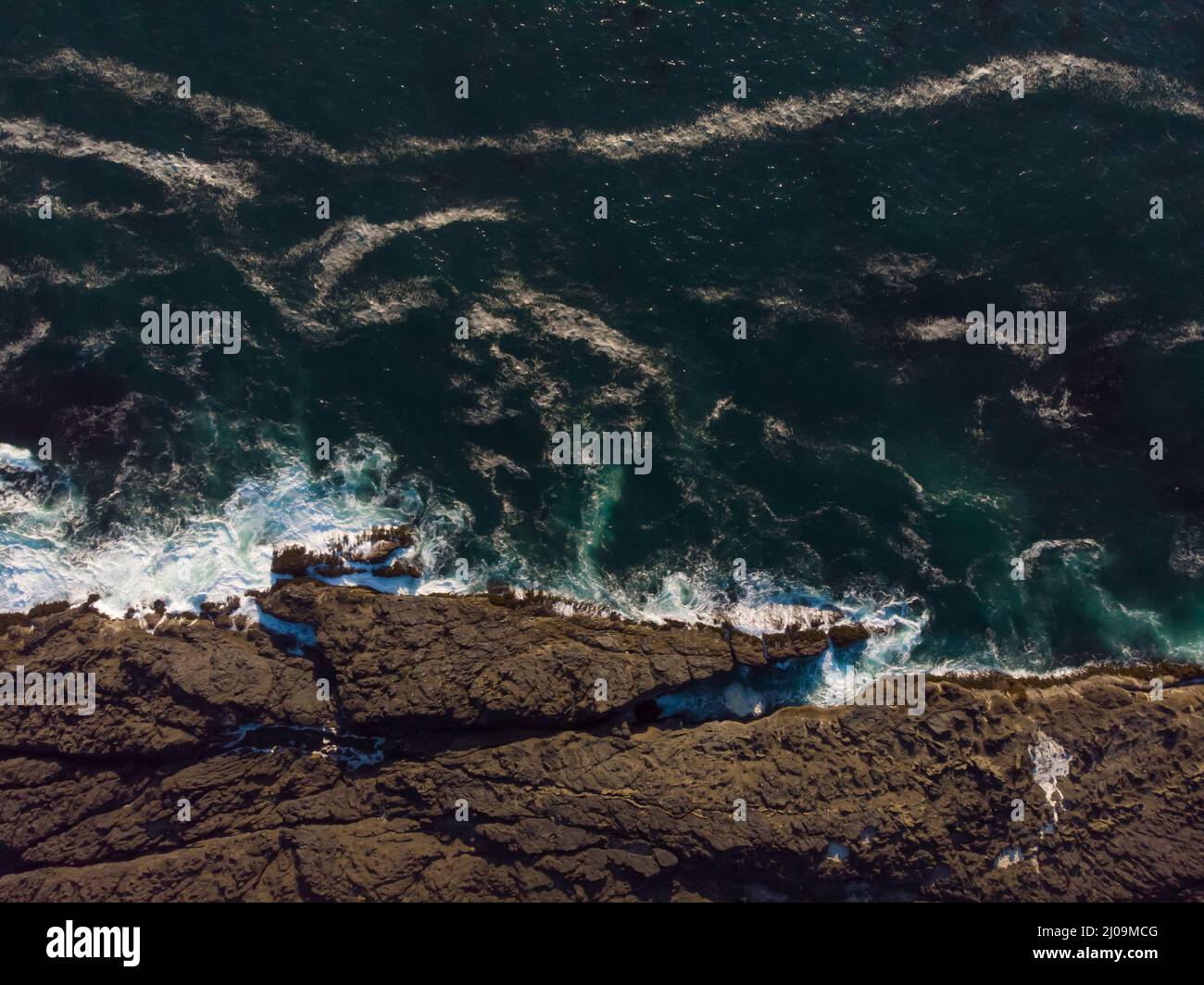 Aerial drone view of ocean waves and fantastic rocky coast. Wallpaper ...