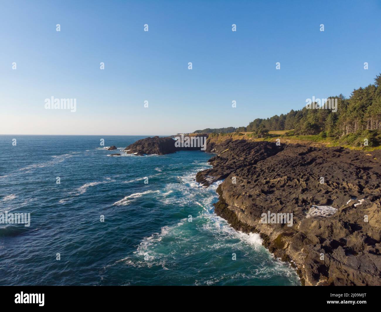 Aerial drone panoramic view of rocky cost in the ocean waves. Beautiful ...