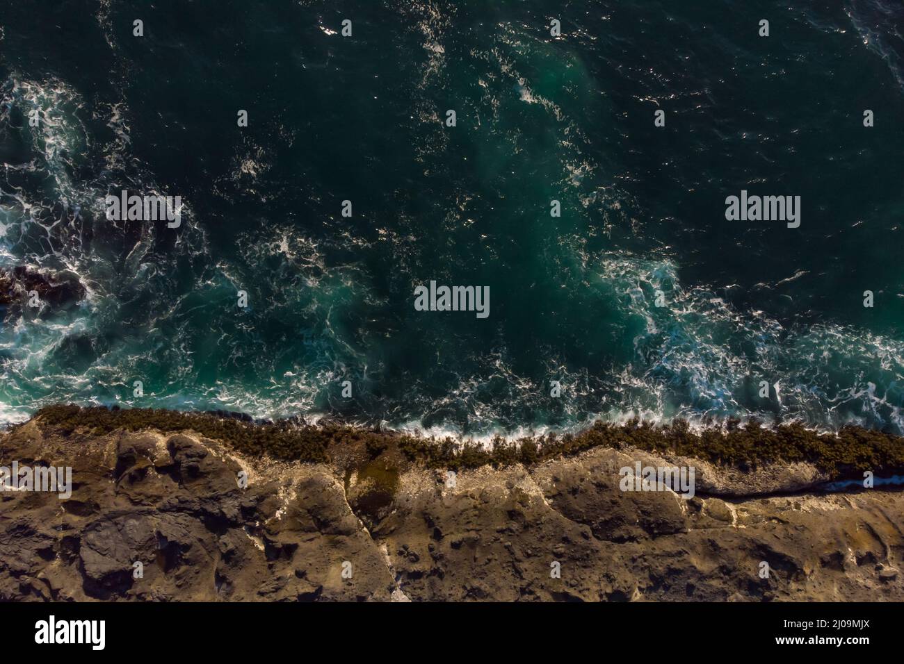 Aerial view of ocean waves and fantastic rocky coast. Wallpaper design ...