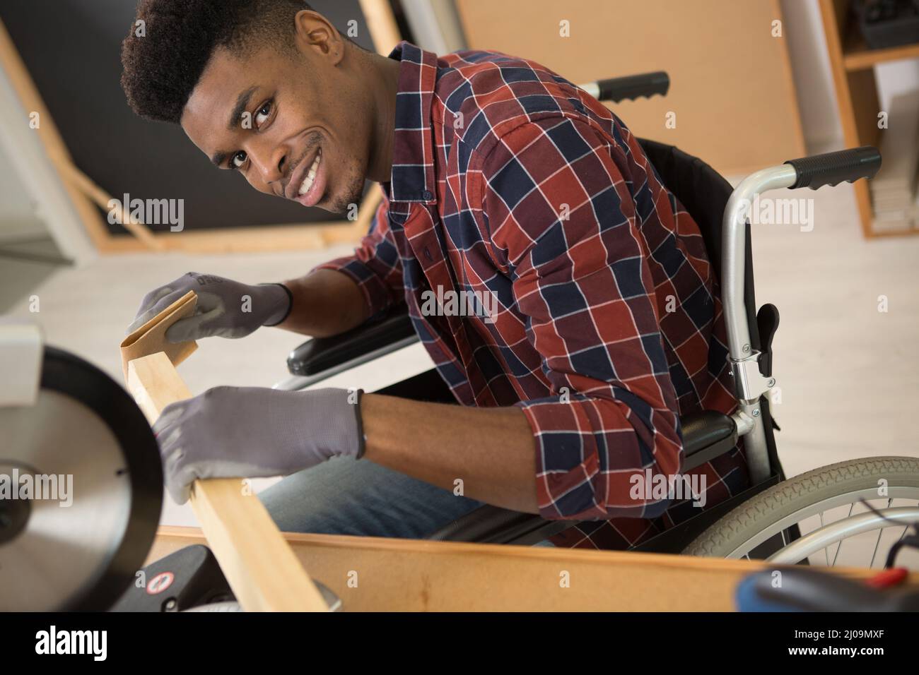 Disabled carpenter working in hi-res stock photography and images - Alamy