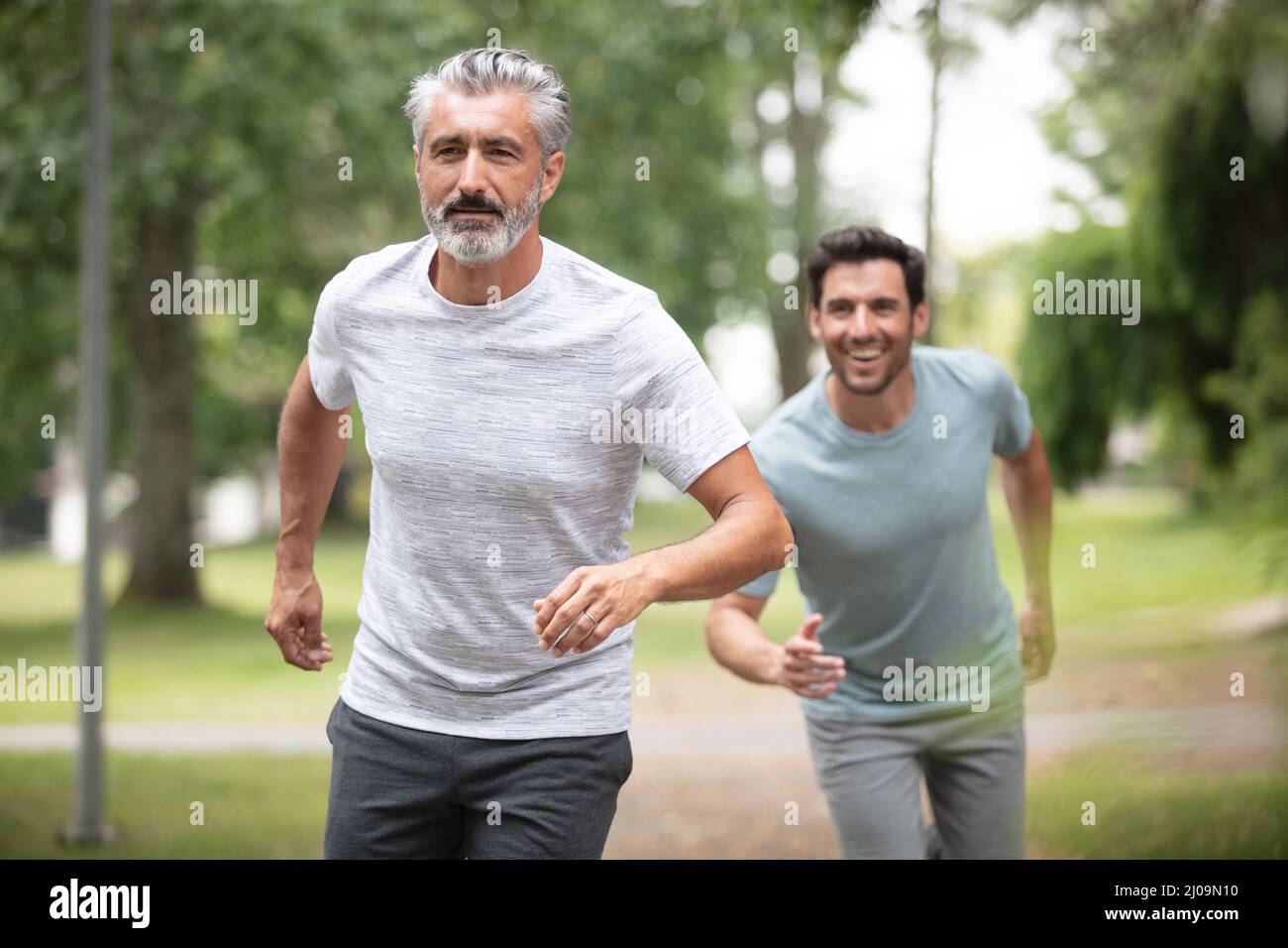 Three men running in marathon hi-res stock photography and images - Alamy