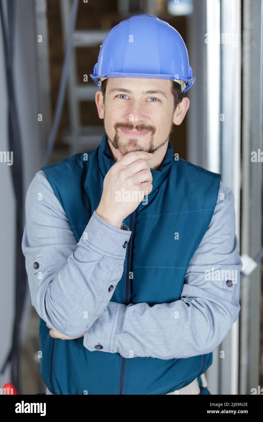 portrait of an attractive worker on a construction site Stock Photo - Alamy