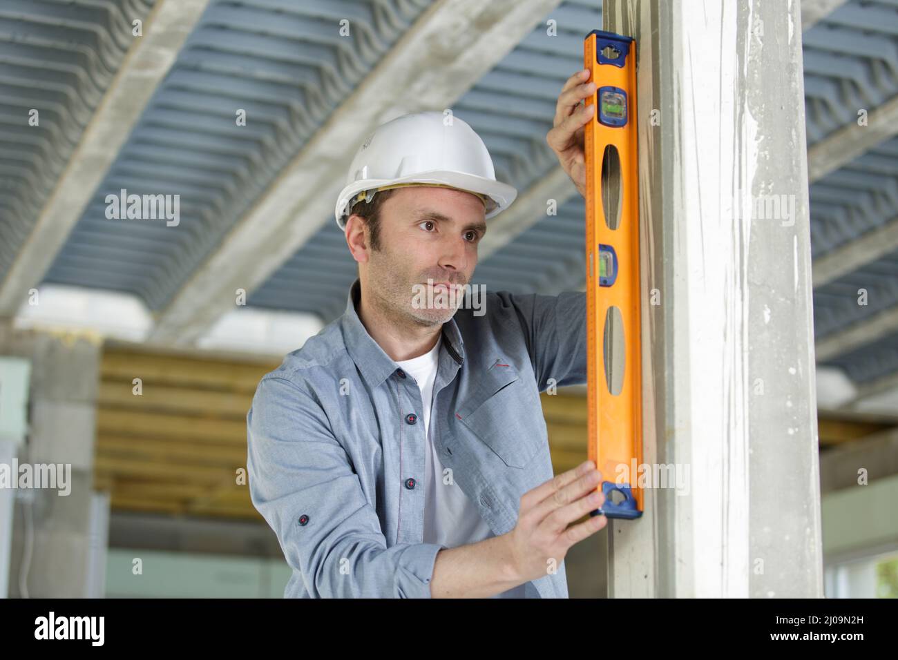master carries out measurements of the level of construction Stock ...