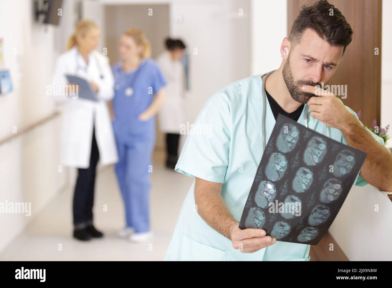 doctor radiologist looking at x-ray images Stock Photo - Alamy