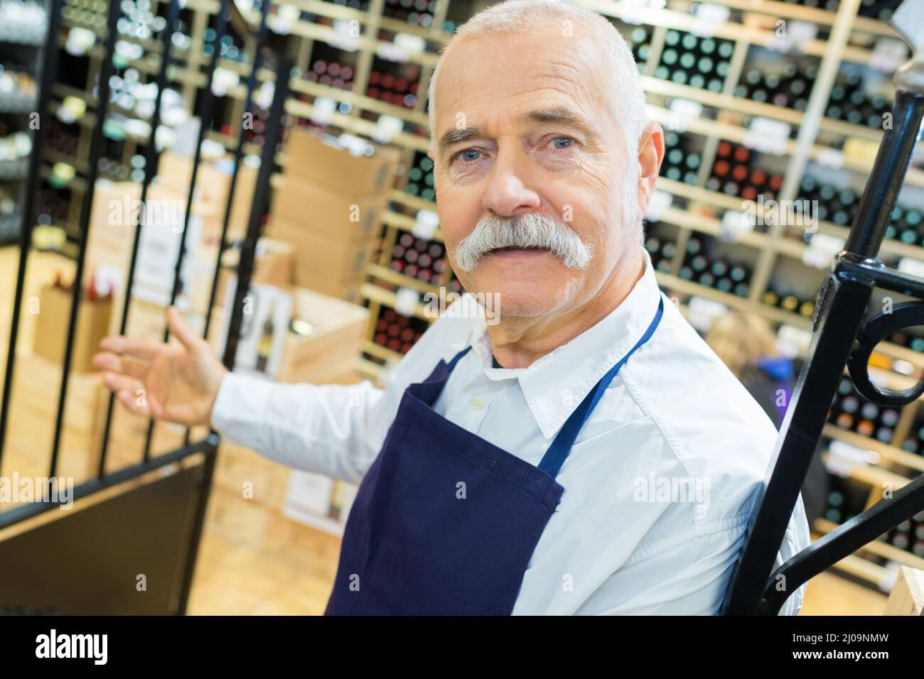 Male seller wearing uniform hi-res stock photography and images - Alamy
