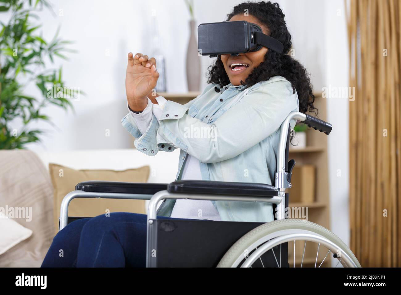 disabled smiling young woman in vr Stock Photo - Alamy