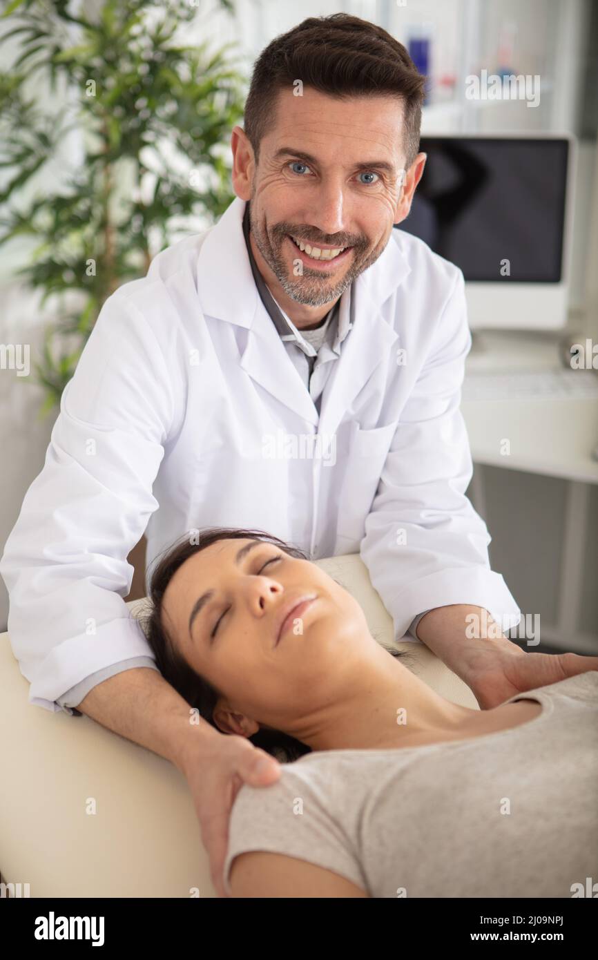 Woman shoulder massage wellness center hi-res stock photography and ...