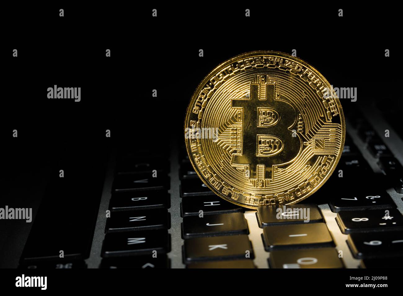 Gold coin bitcoin on the keyboard Stock Photo - Alamy