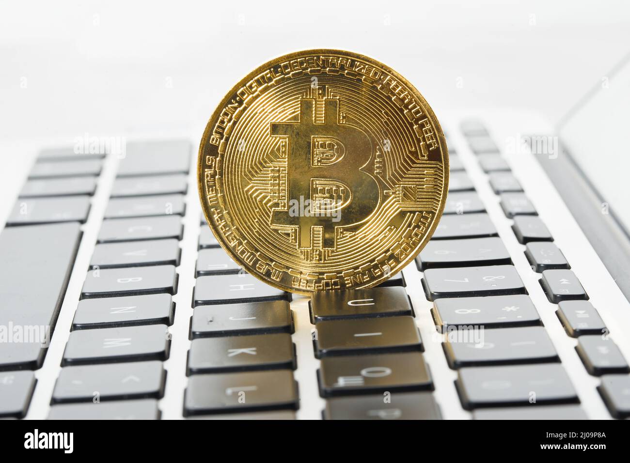 Gold coin bitcoin on the keyboard Stock Photo - Alamy