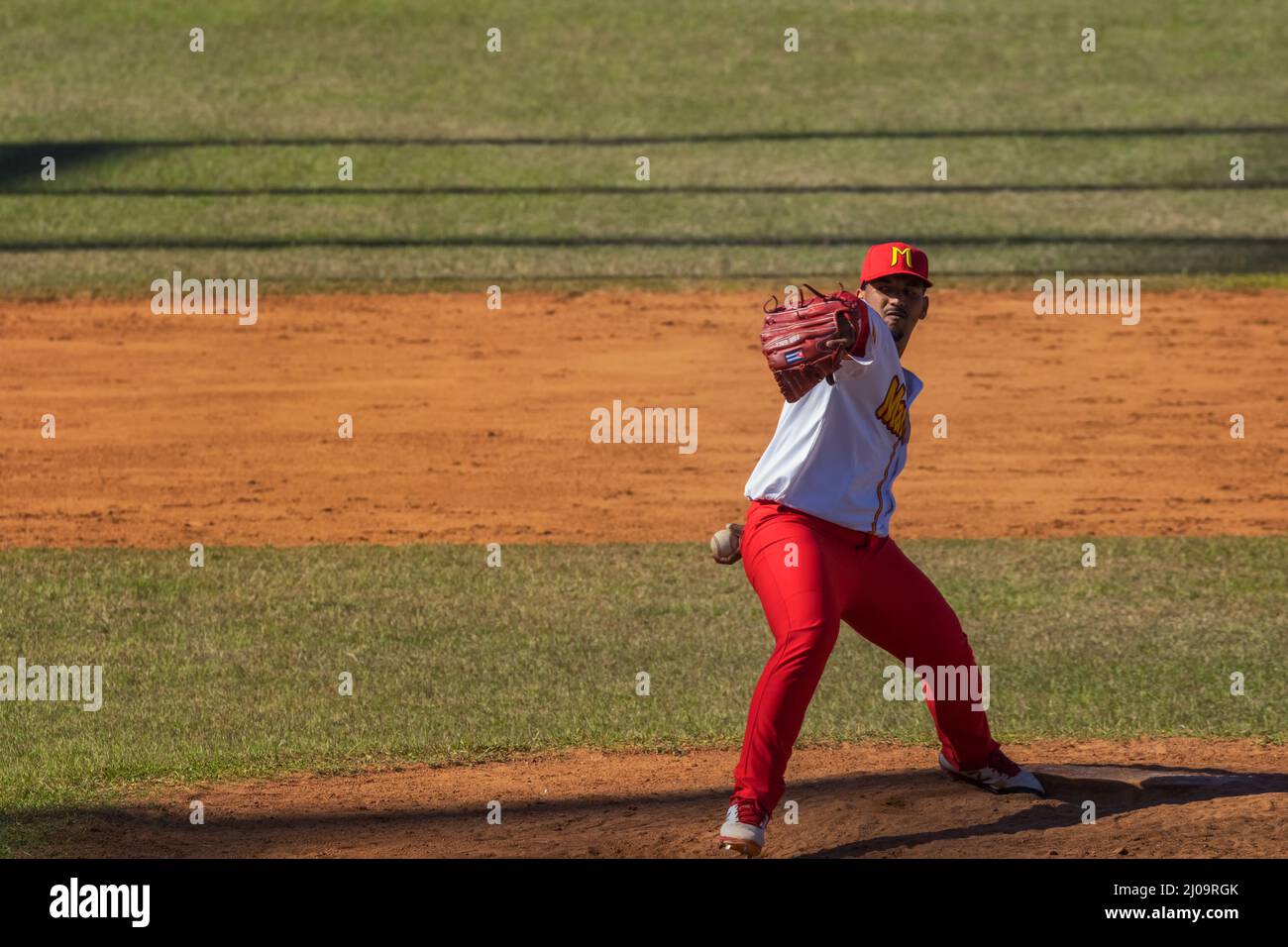 Man playing softball hi-res stock photography and images - Alamy