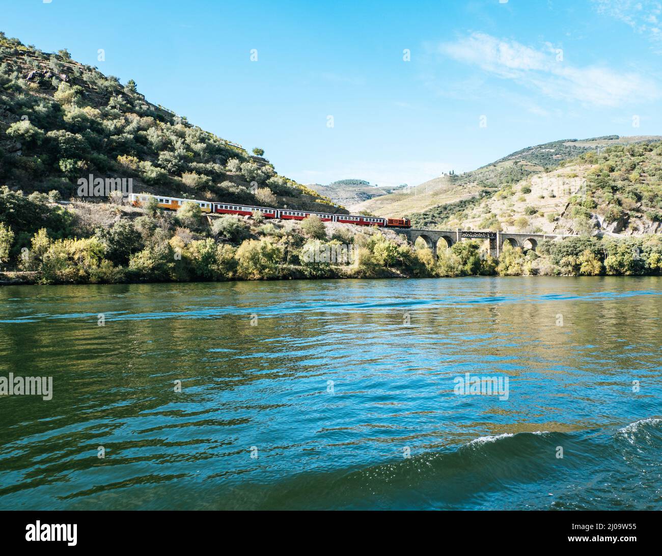 Bridge with train tracks crossing Douro River in the Douro Valley ...