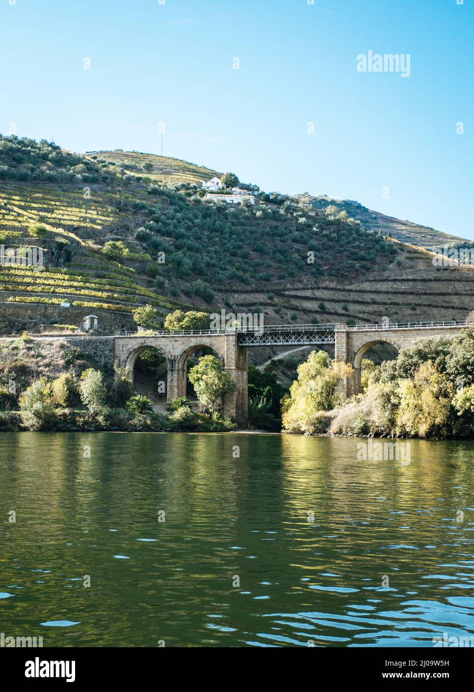 Bridge with train tracks crossing Douro River in the Douro Valley ...