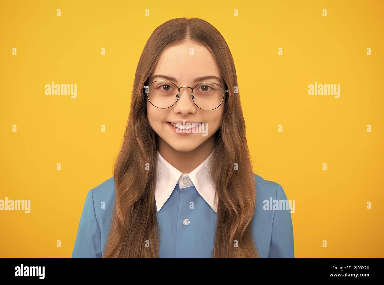 Tween girl. Happy girl child in eyeglasses yellow background. Girls ...