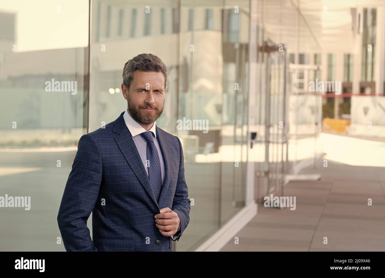 successful man boss in businesslike suit. manager outside the office ...