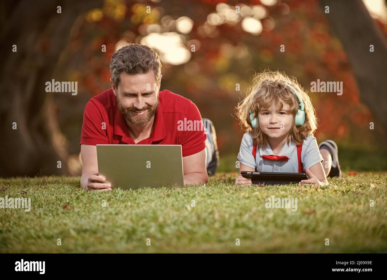 father and son use laptop for video call or lesson listen music in ...