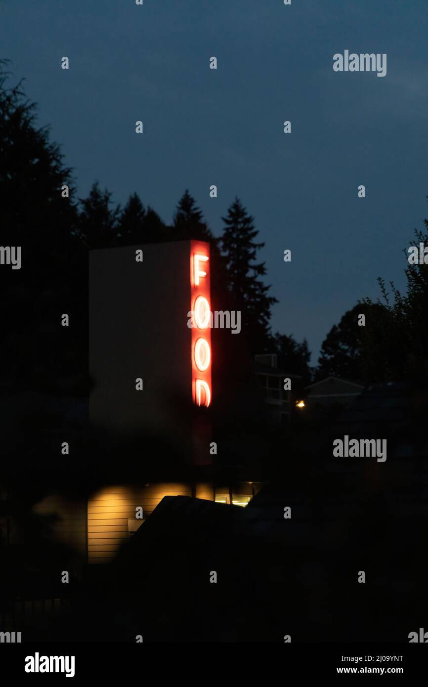 vertical neon food sign glowing in the dark late at night Stock Photo ...