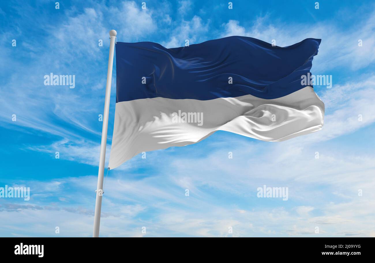 flag of Assen , Netherlands at cloudy sky background on sunset ...