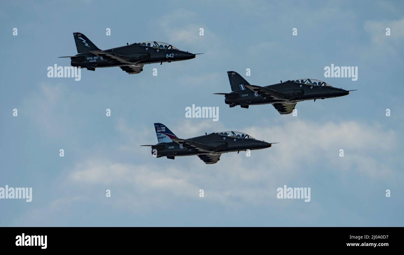 Black Royal Navy Hawk aircraft over Portsmouth Harbour, UK on the 17th ...
