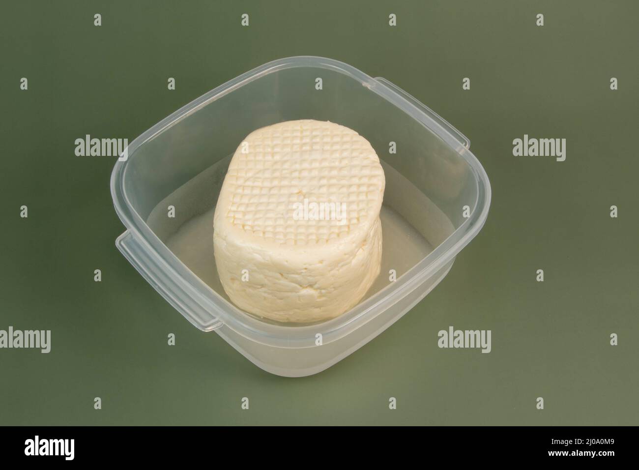 typical Brazilian Minas cheese from Minas Gerais in transparent plastic ...