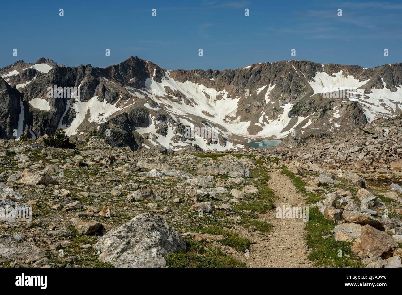 Small Tarn Below Mountain Slopes in the Tetons in summer from ...