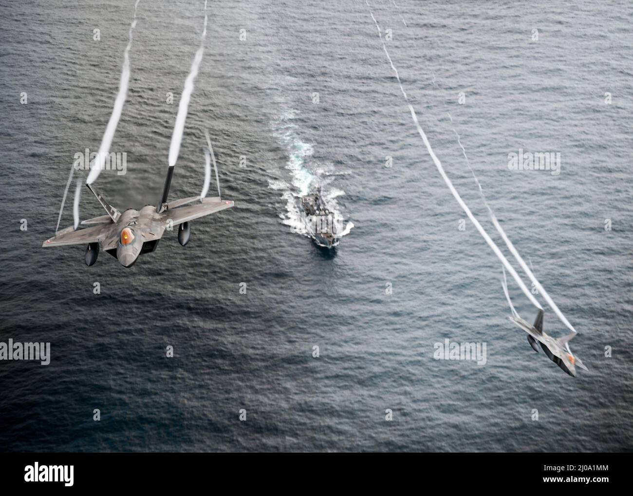 U.S. Air Force F-22 Raptors, assigned to Alaska NORAD Region, fly over ...