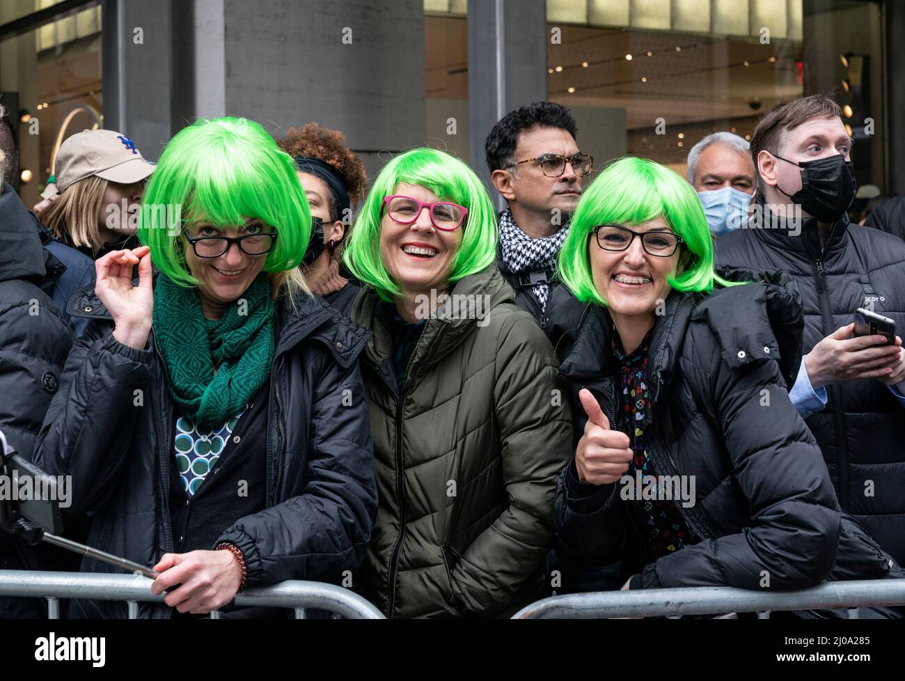 New York, NY - March 17, 2022: Thousand spectators lined up along 5th ...