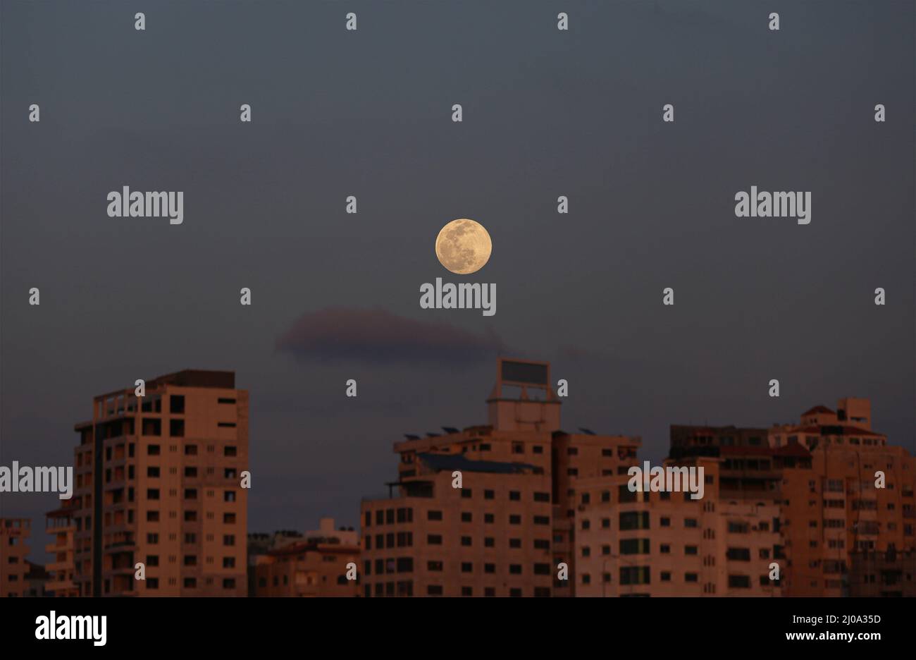 Full moon over the sky of Gaza City. Badr Sha'ban decorates the sky ...