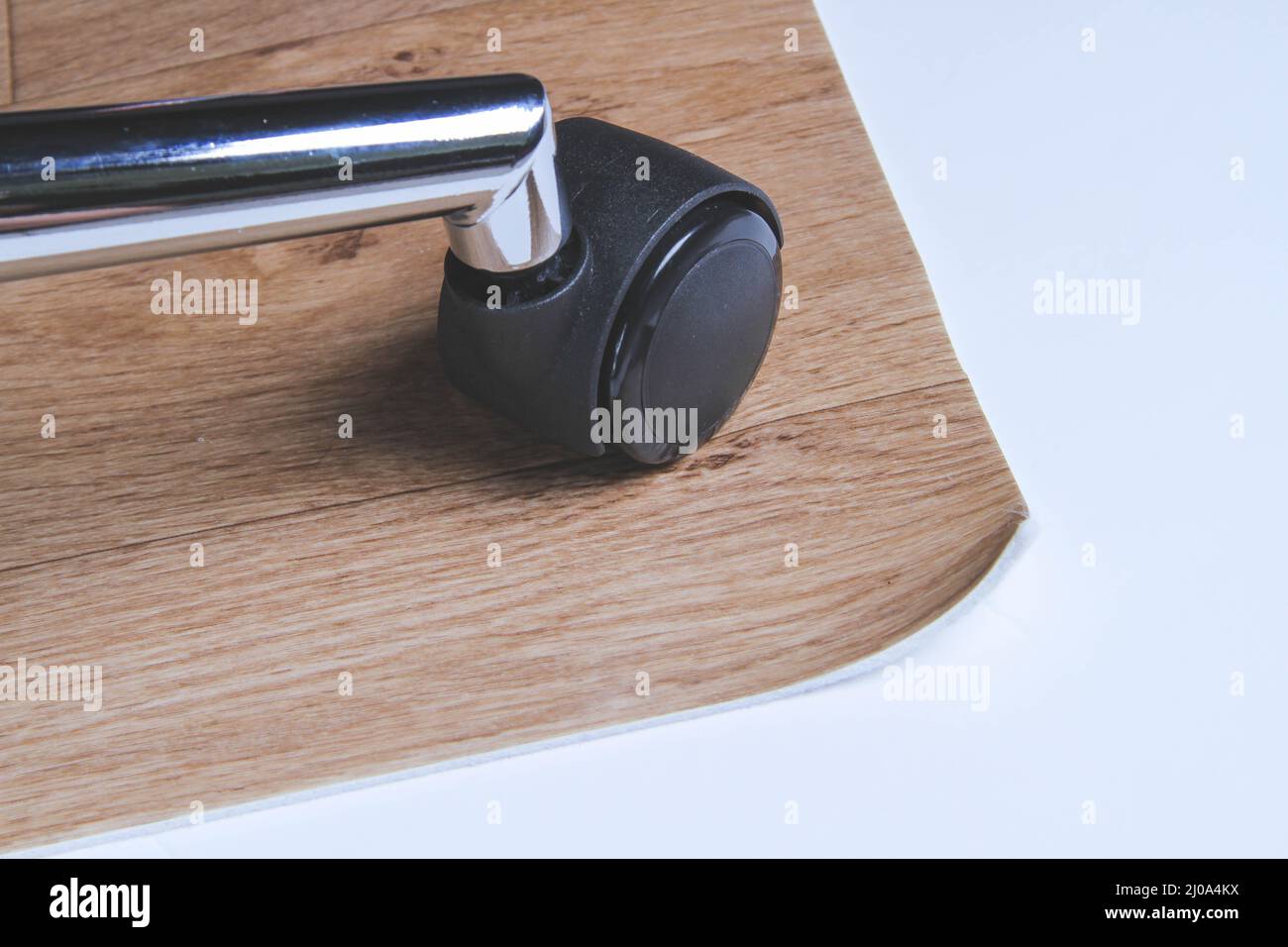 Linoleum in the office. Armchair on wheels on linoleum. Floor ...