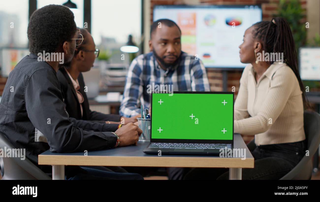 Team of african american people having laptop with green screen ...
