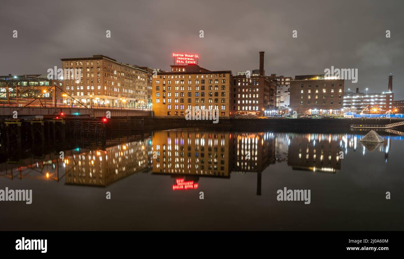 Beautiful nightscape of the waterfront buildings in downtown Boston ...