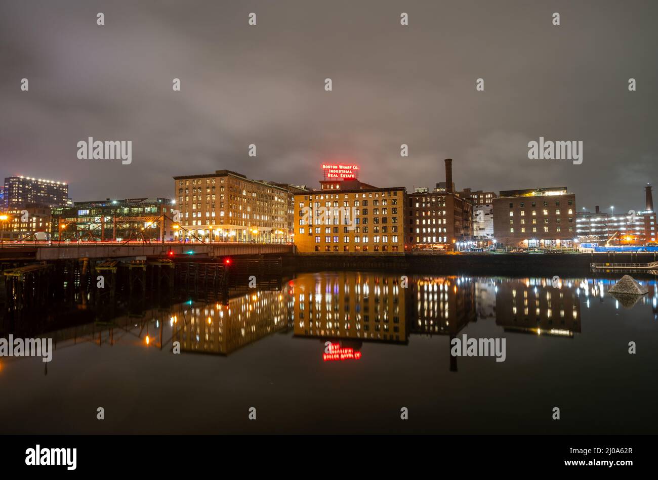 Beautiful nightscape of the waterfront buildings in downtown Boston ...
