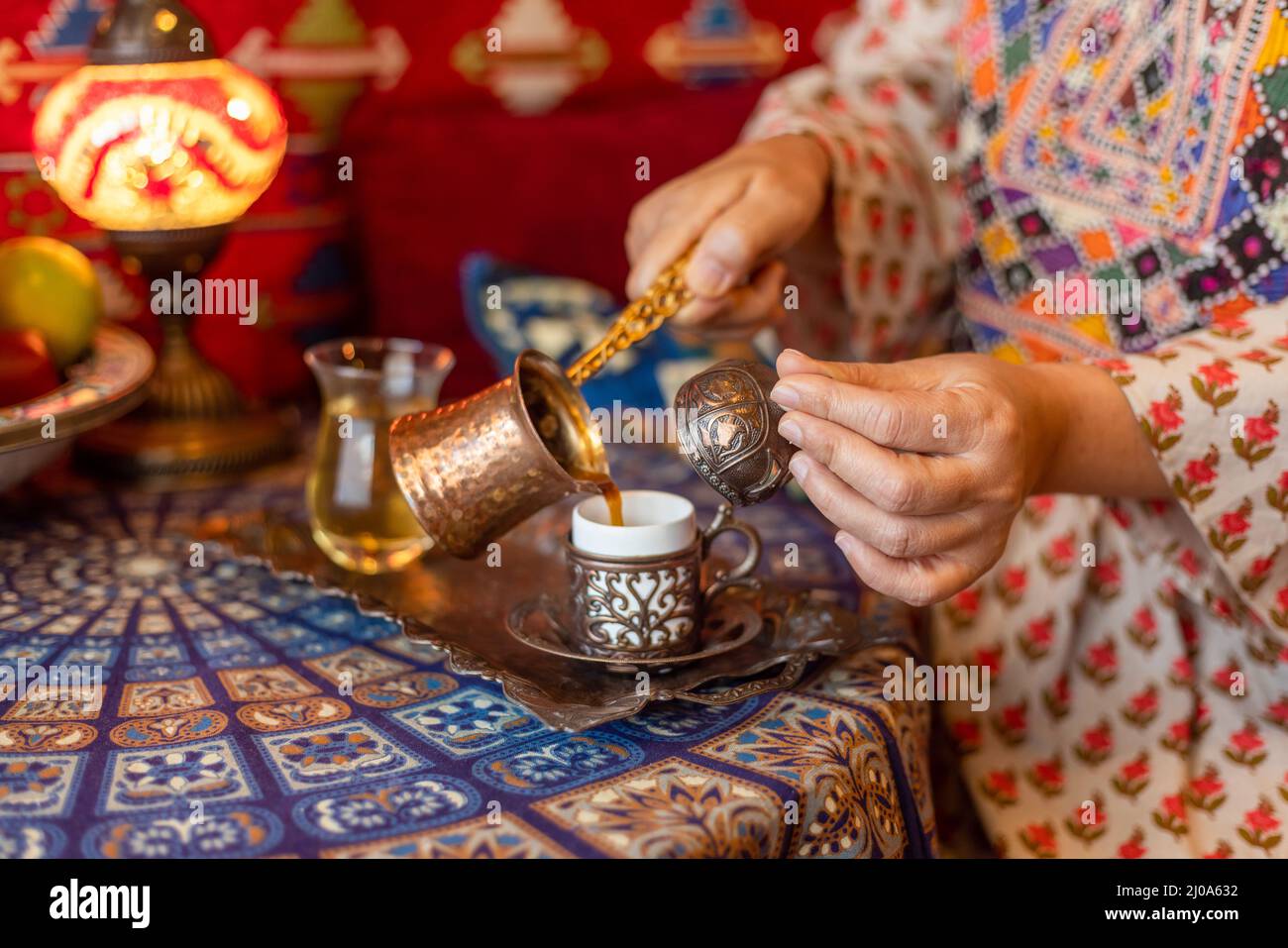 Woman pouring coffee from pot hi-res stock photography and images - Alamy