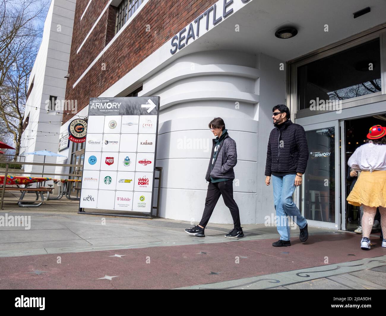Seattle, WA USA - circa March 2022: People coming and going from the ...