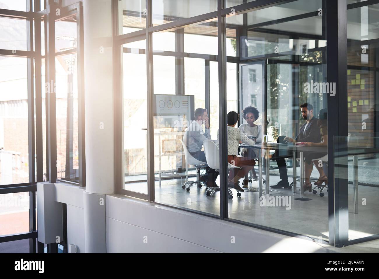 Handling their business in the boardroom. Full length shot of a group ...